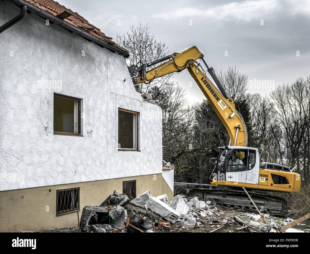 Excavator demolishing a house Stock Photo - Alamy