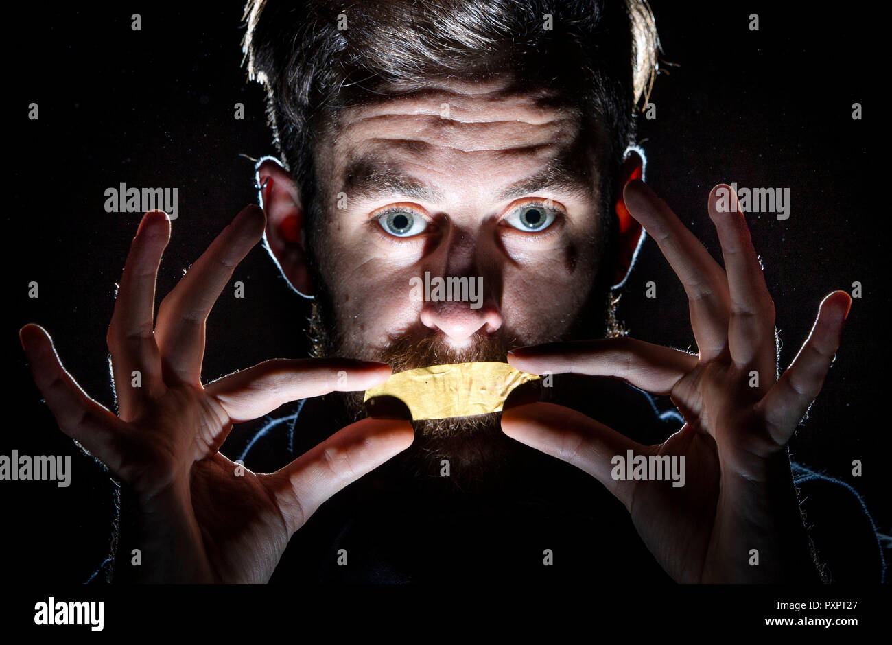 Yorkshire Museum's Assistant Curator of Archaeology Adam Parker holds a ...