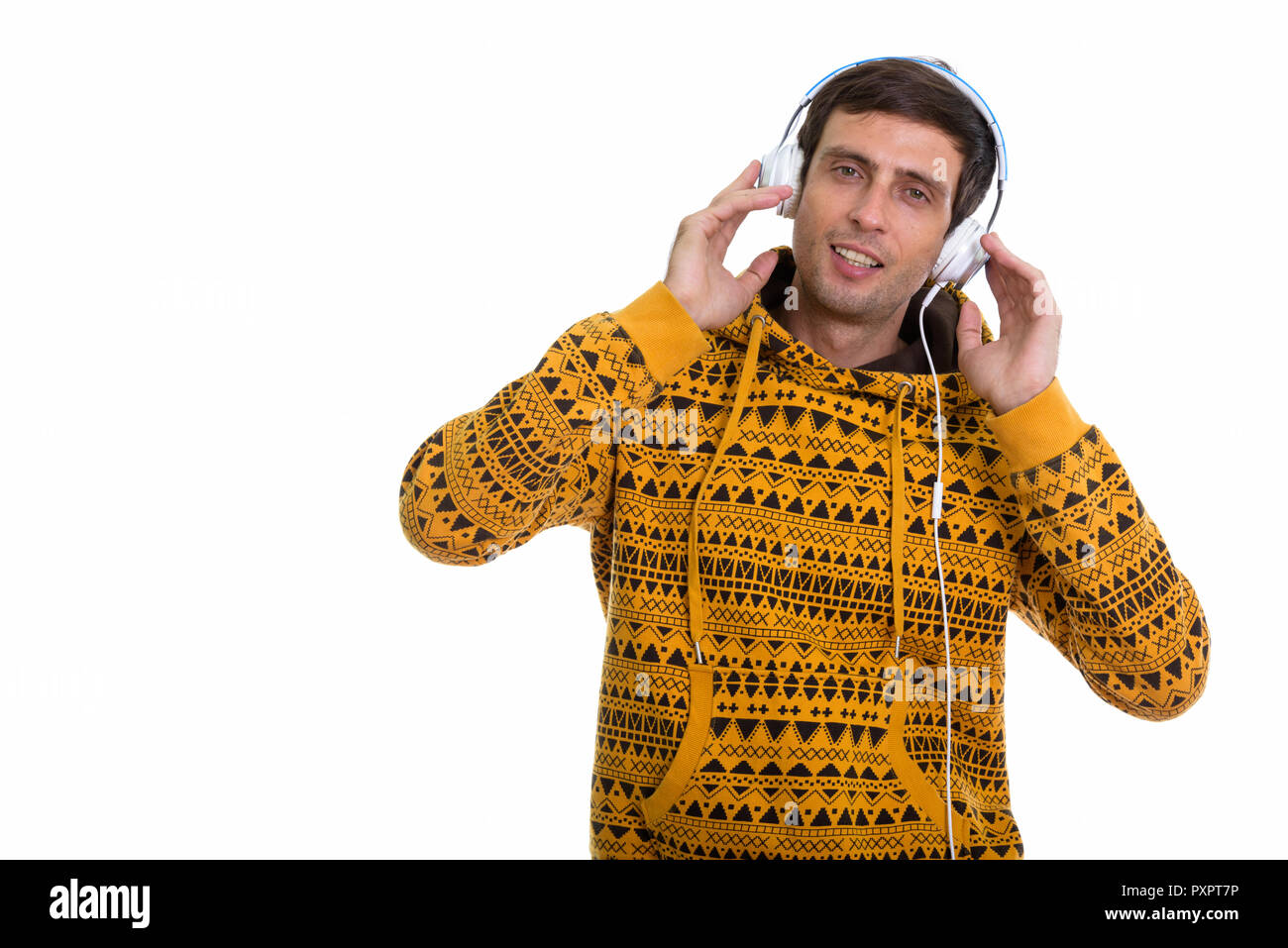 Happy young man listening music hi-res stock photography and images - Alamy