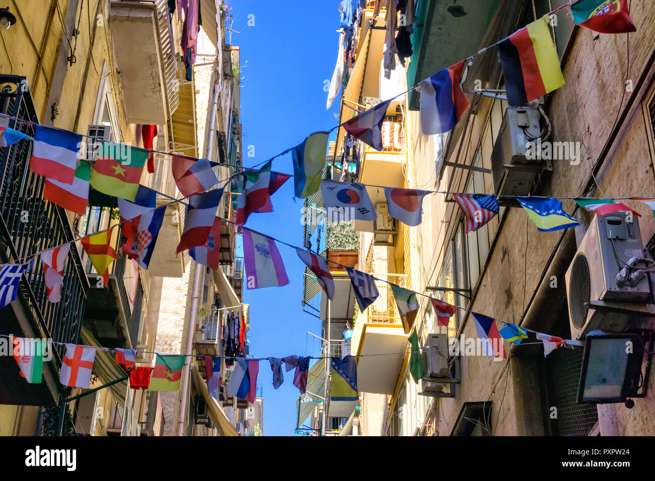Flags of different countries adorn the street in the center of the city ...