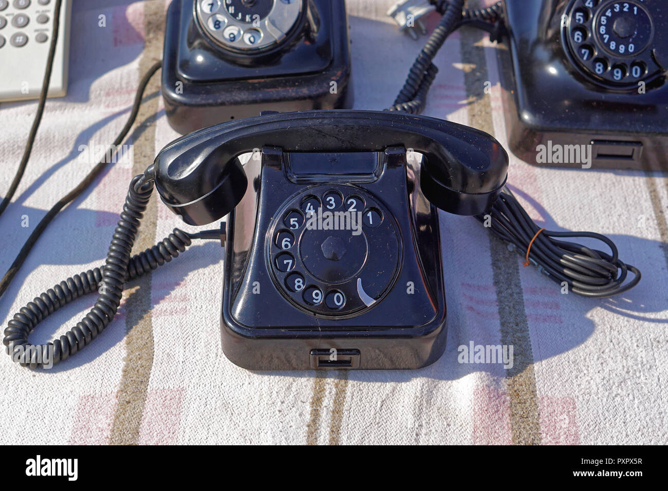 Black bakelite retro telephone at flea market Stock Photo - Alamy