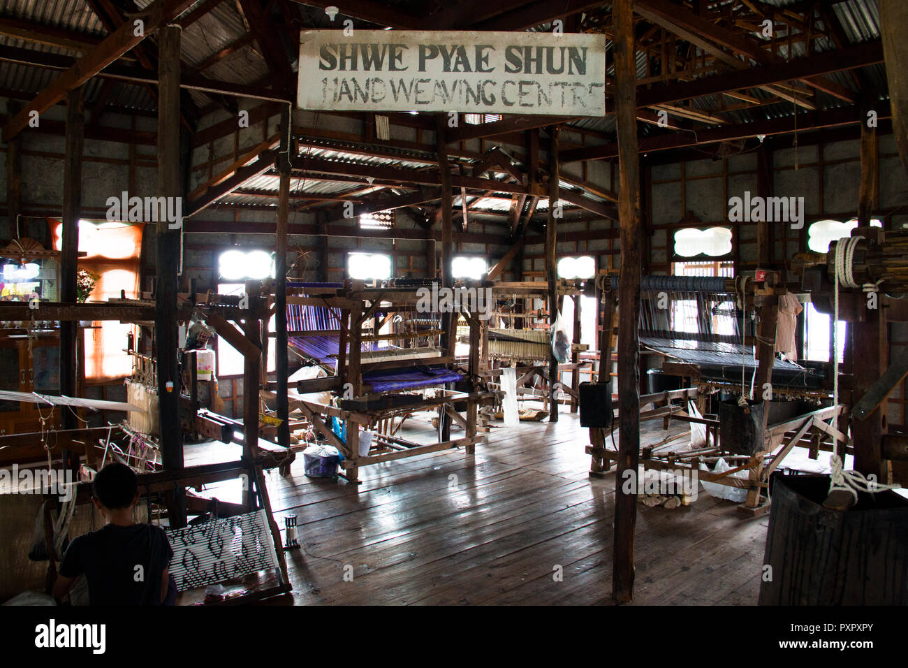 INLE LAKE, MYANMAR - MARCH 2018: People weaving clothes in the ...