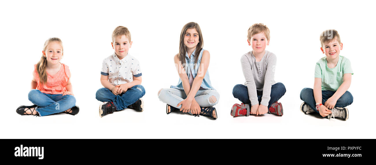 A Group Of five Young Children In Studio Stock Photo - Alamy