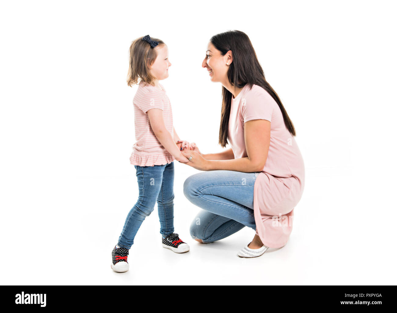 pretty mother standing with her cute daughter Stock Photo - Alamy