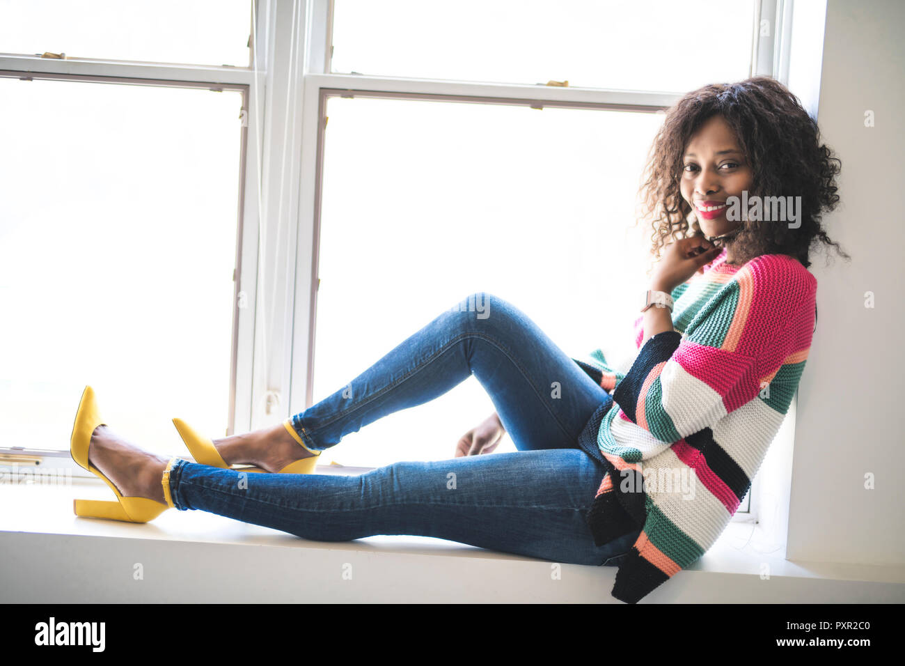 Black women sit on hi-res stock photography and images - Alamy