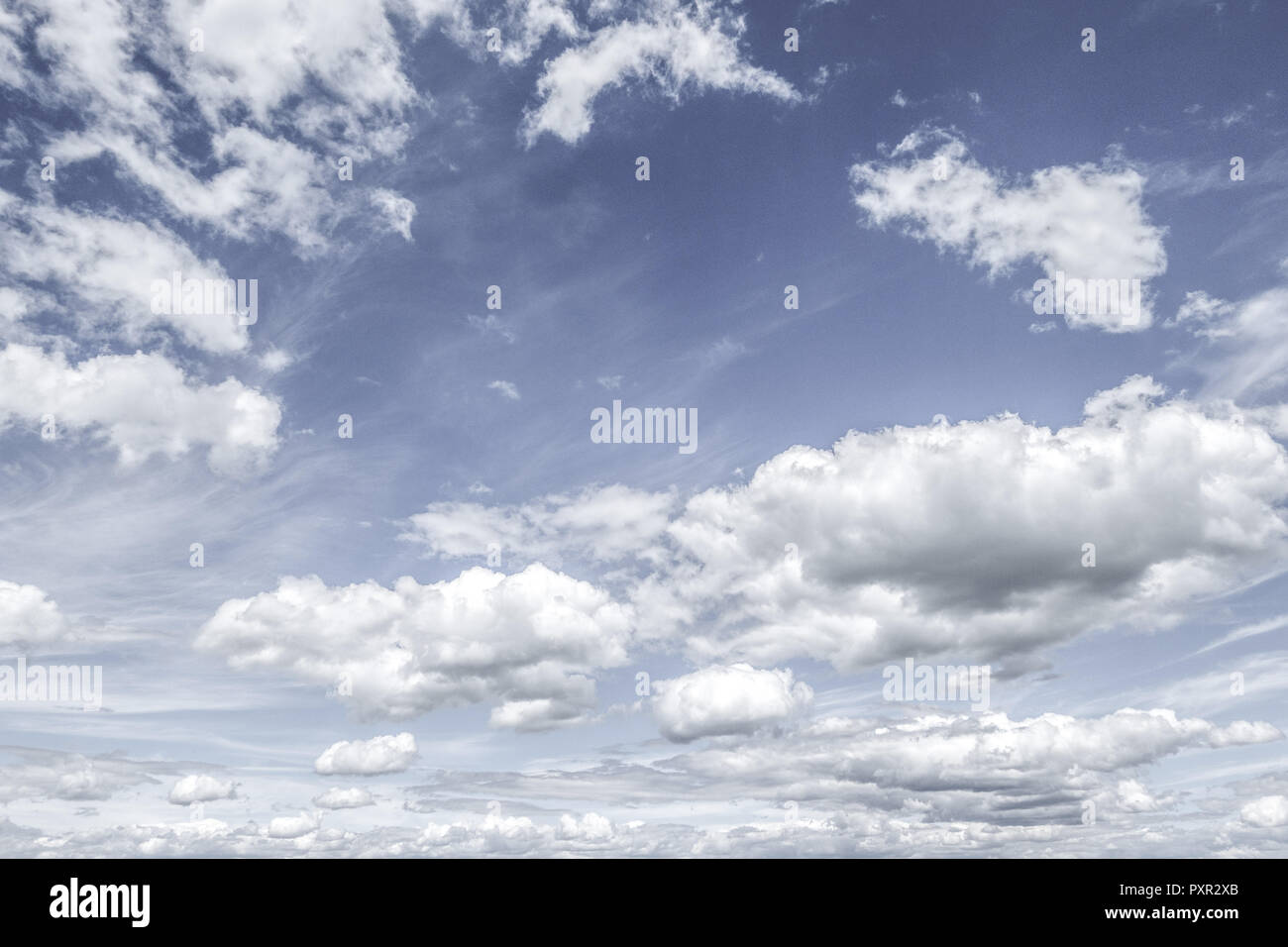 Cumulus clouds against a blue sky Stock Photo - Alamy