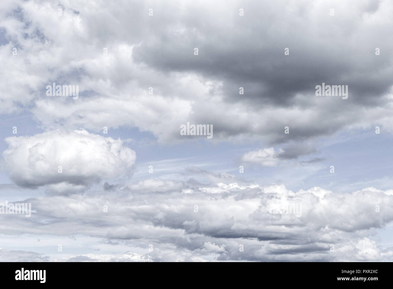 Cumulus clouds against a blue sky Stock Photo - Alamy
