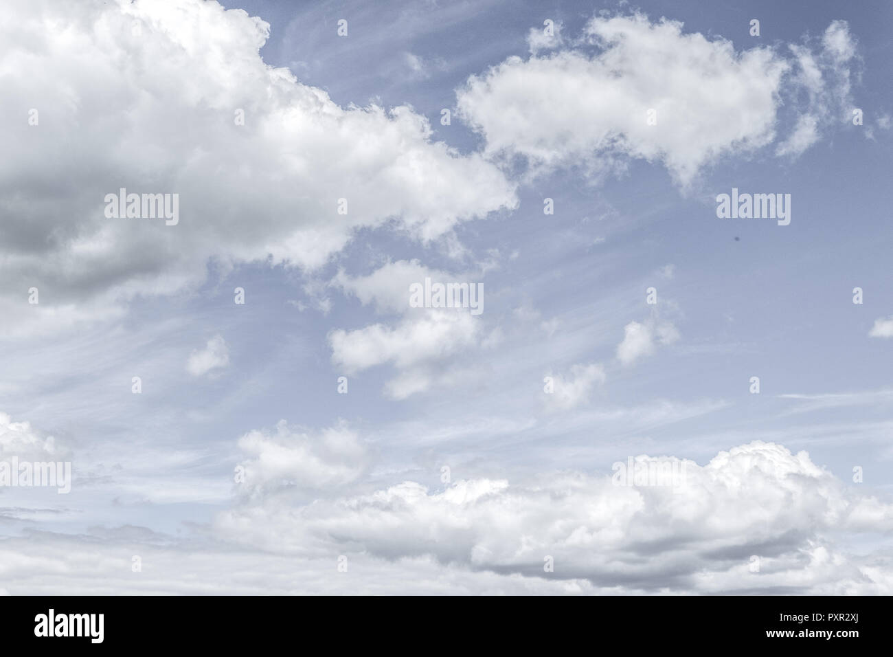 Cumulus clouds against a blue sky Stock Photo - Alamy