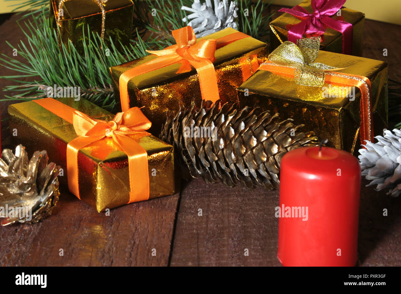 Christmas gift gold, red box with gold color bow and candles. Christmas ...