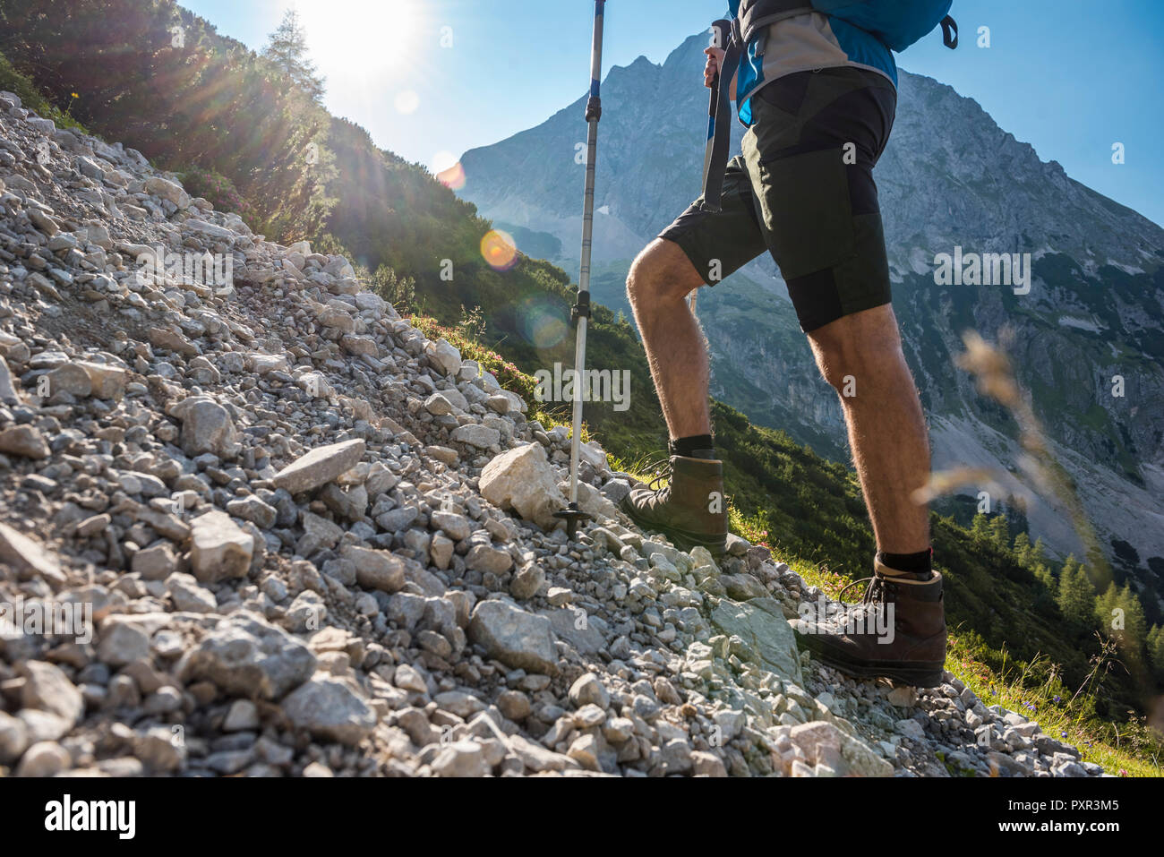 Austria, Tyrol, Young man hiking in the mountains Stock Photo - Alamy