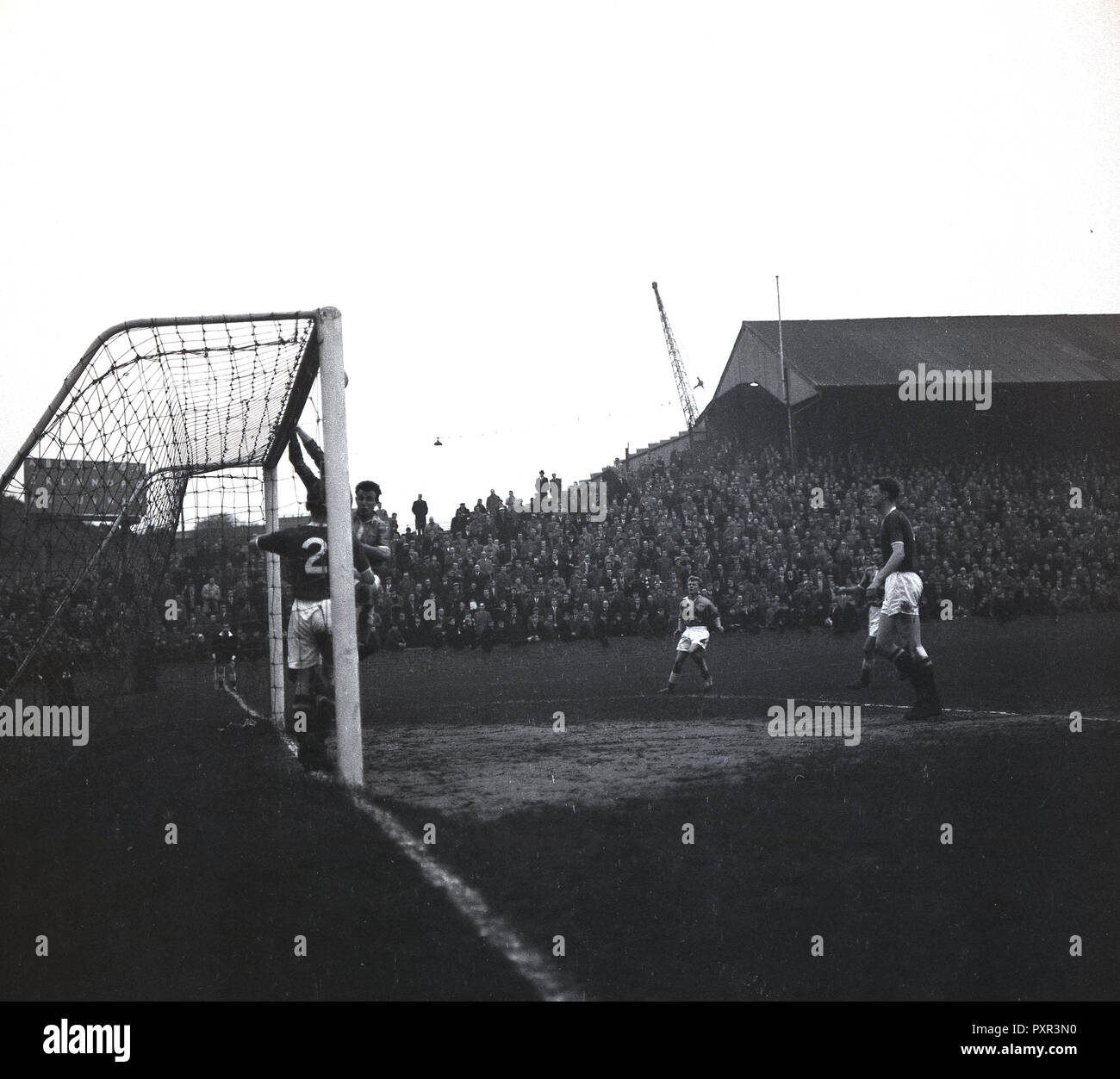 1950s, historical, goalmouth action at a football match taking place at ...