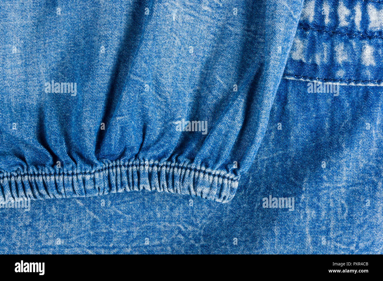 Blue washed faded jeans texture with seams, clothing items, macro ...