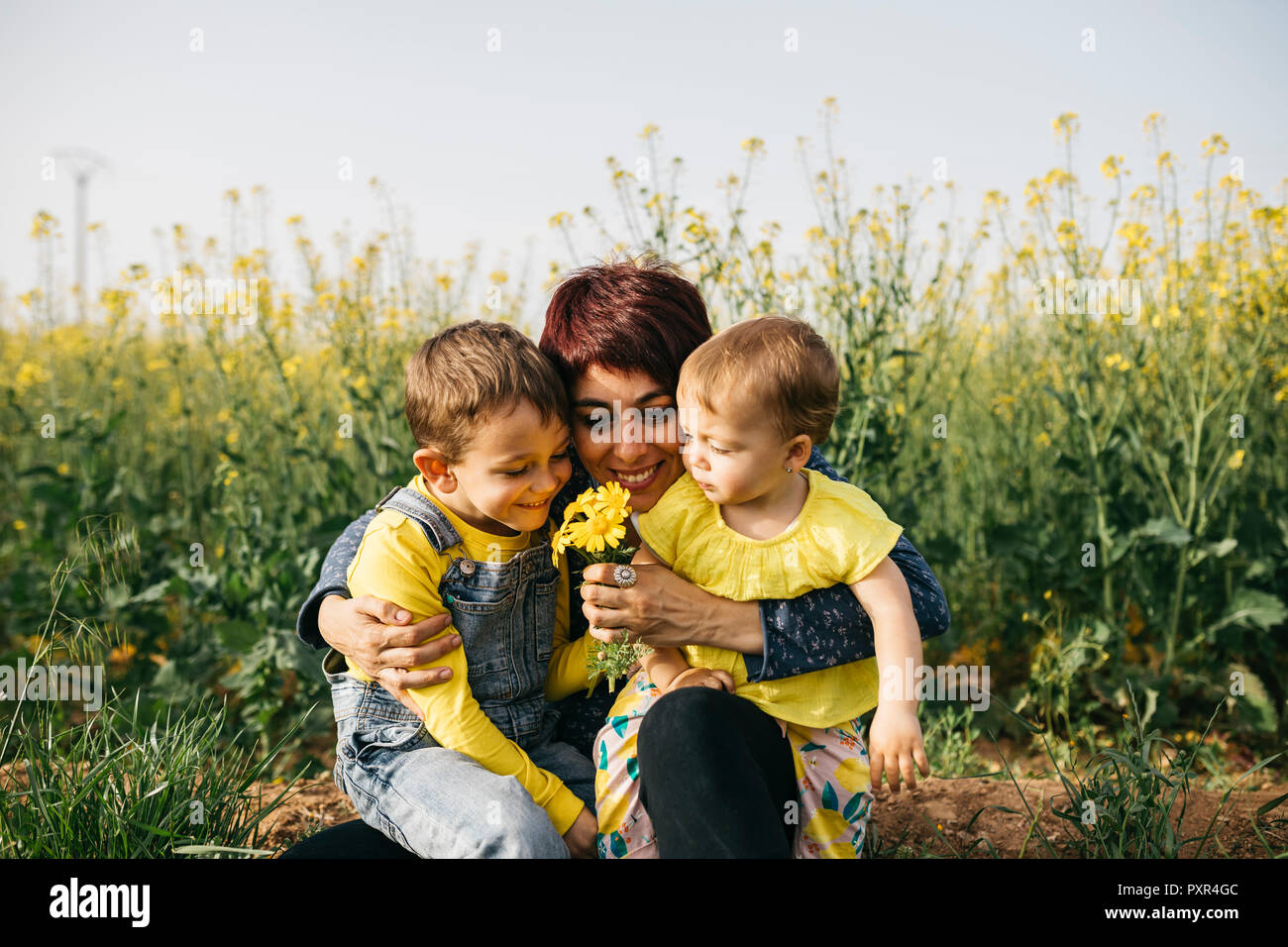 Happy mother with little son and daughter in nature Stock Photo - Alamy