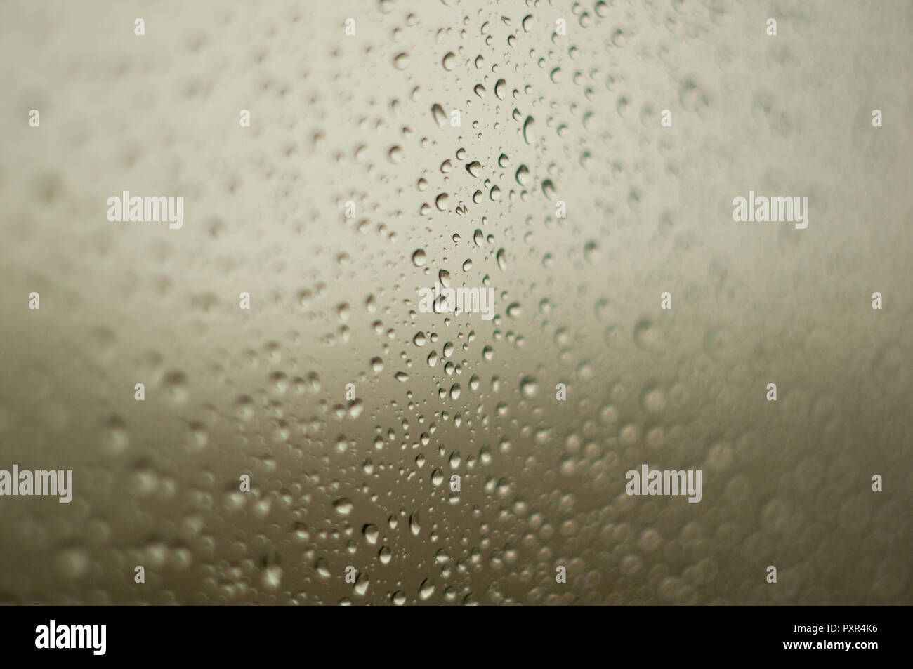 raindrops on the window glass, toned, close up Stock Photo - Alamy