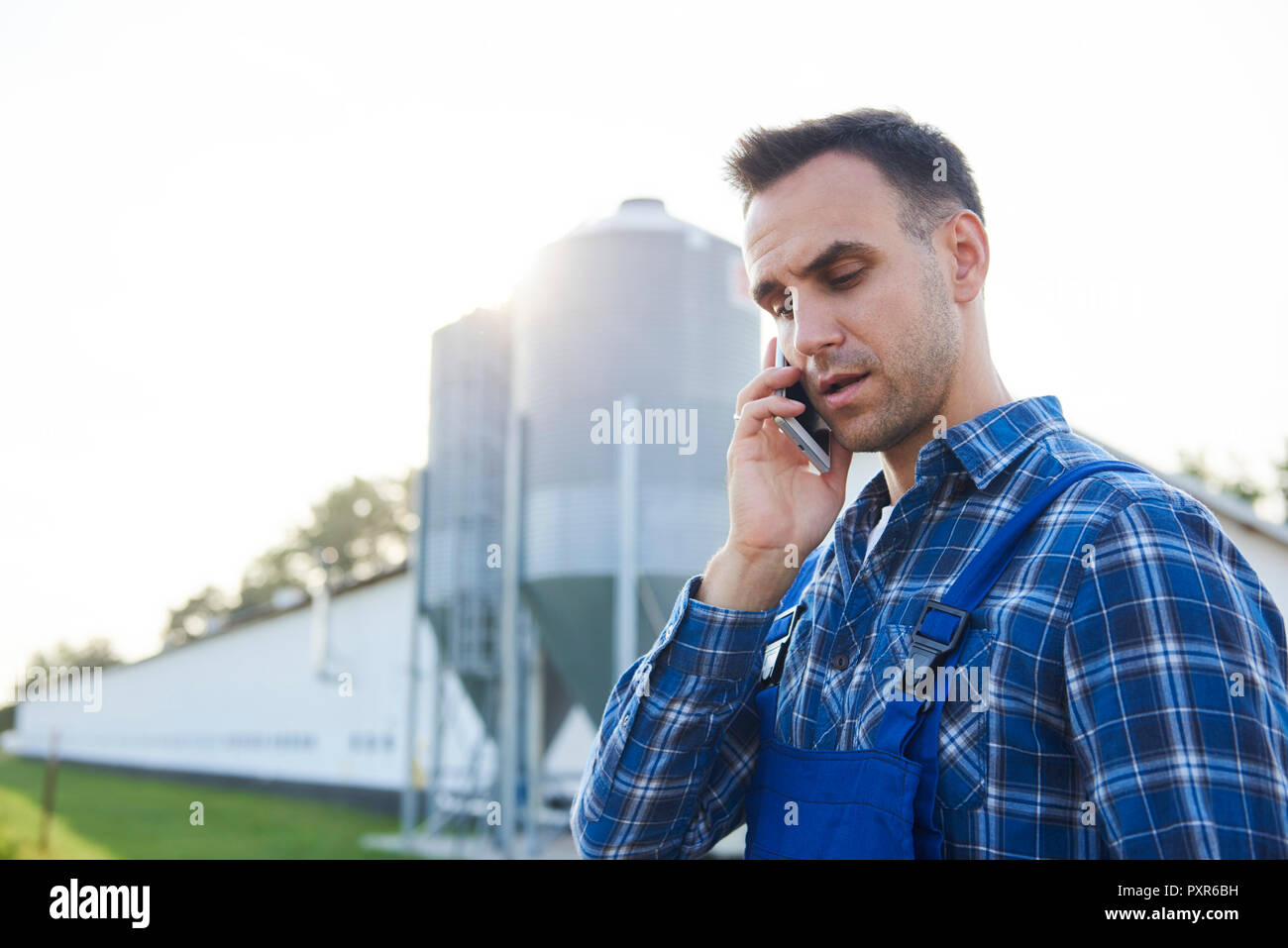 Farmer talking on phone hi-res stock photography and images - Alamy