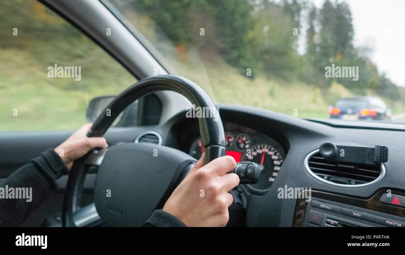 Young woman driving on motorway Stock Photo - Alamy