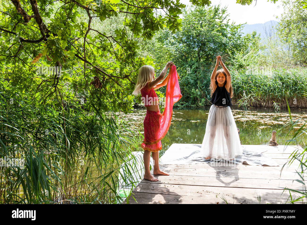 Two girls standing on jetty hi-res stock photography and images - Alamy