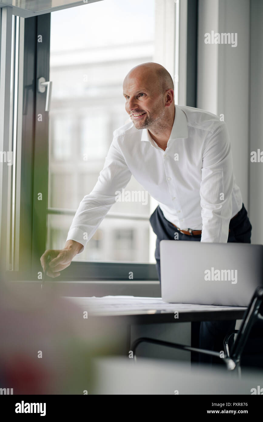 Engineer working in his office, making a video call Stock Photo - Alamy