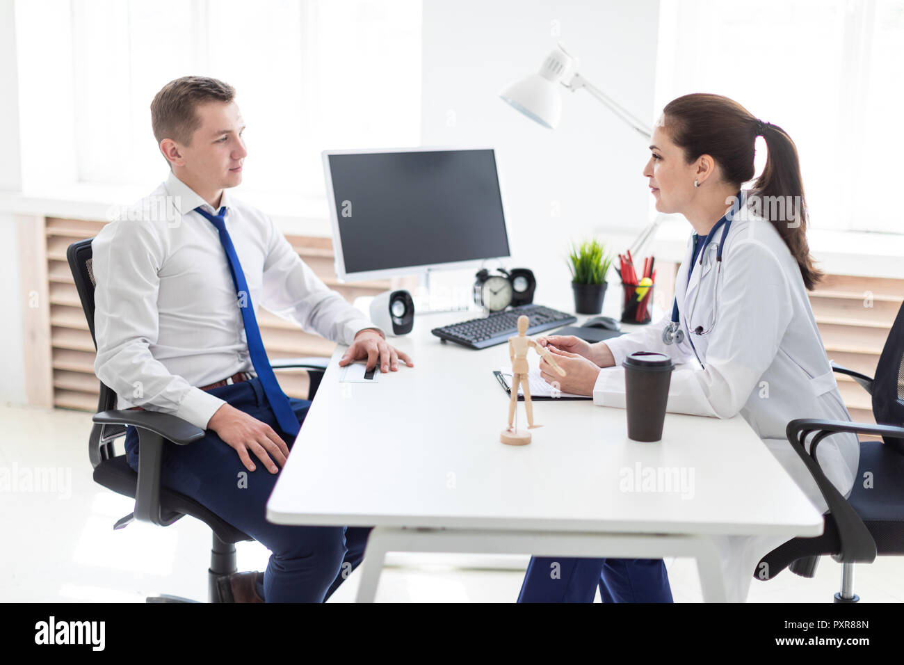 The young man came to see the doctor Stock Photo - Alamy