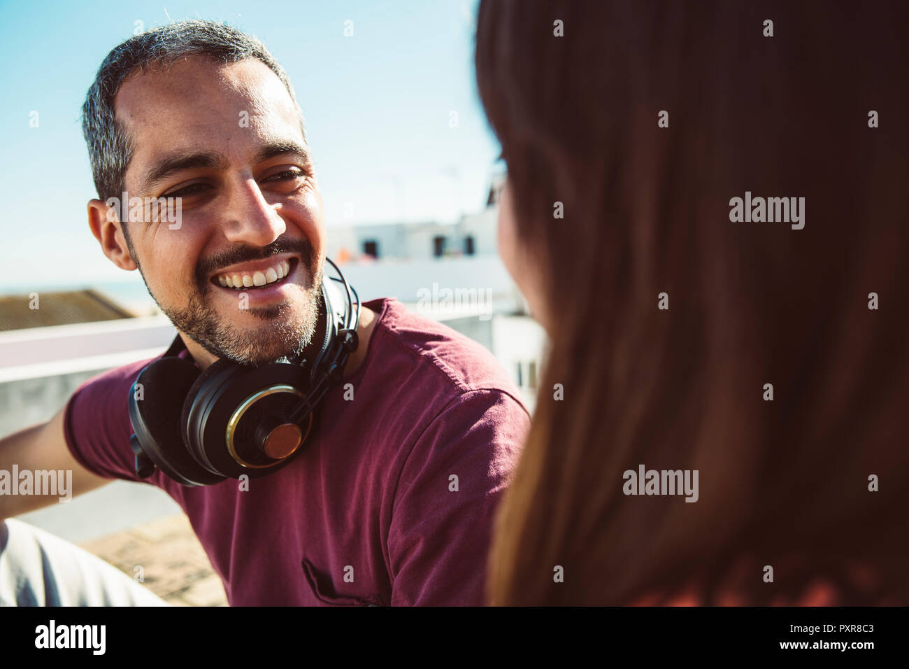 Two people facing each other talking hi-res stock photography and ...