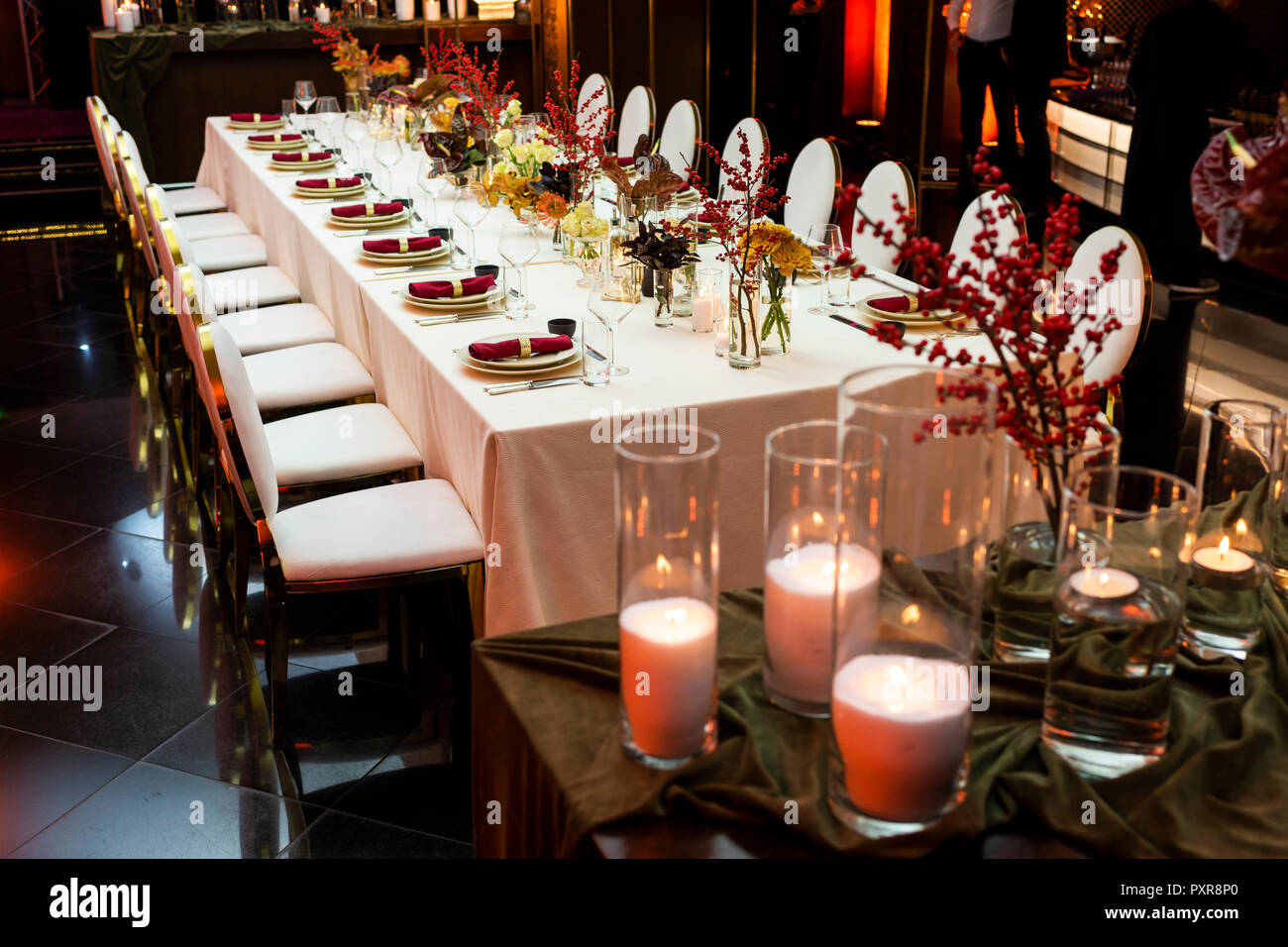 decorated table for a big celebration in the evening in a restaurant ...