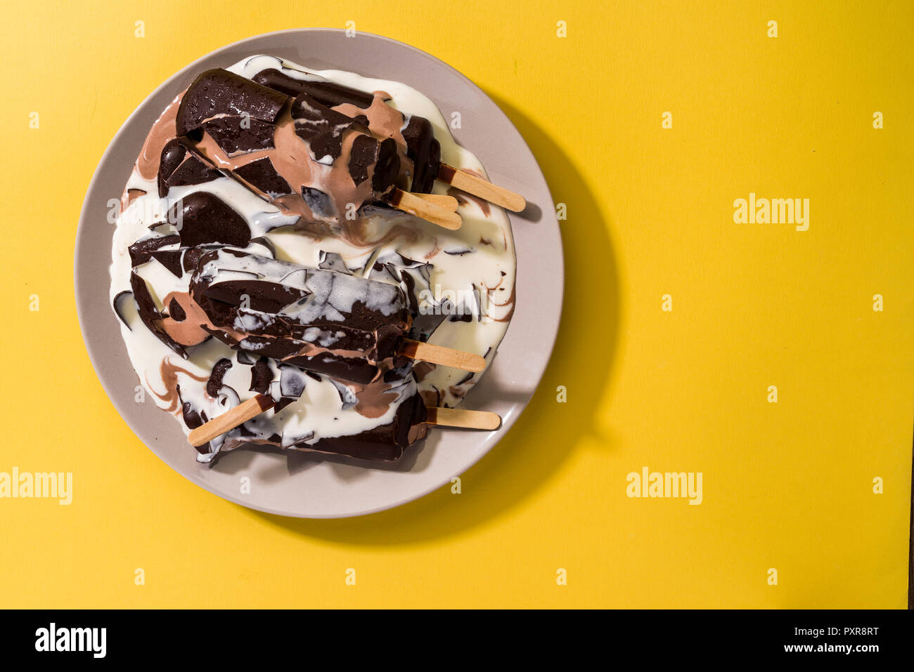 melted ice cream in a plate Stock Photo - Alamy
