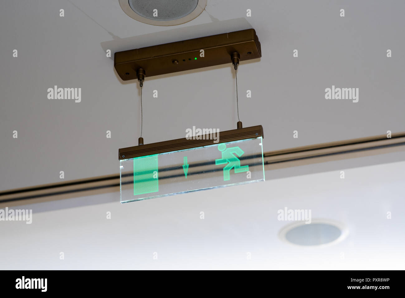 Green Fire Exit Sign Hanging High Resolution Stock Photography and ...