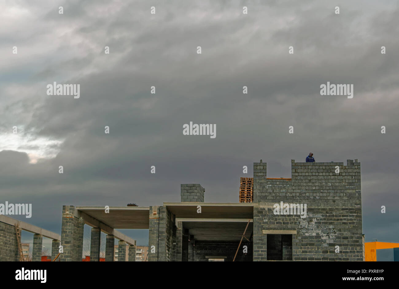 building under construction in evening sky Stock Photo - Alamy
