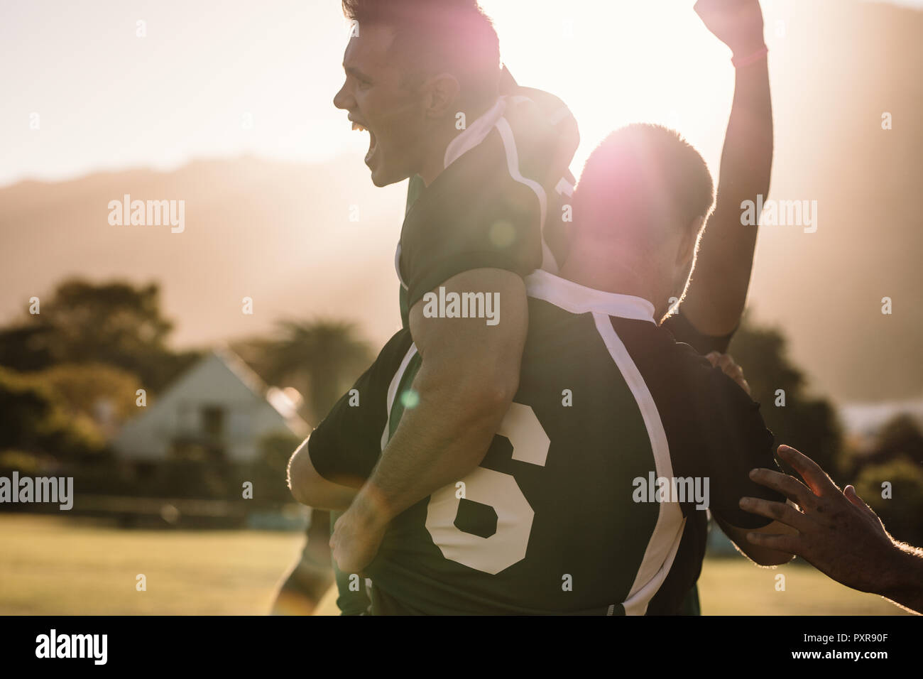 sportsman cheering and screaming with joy after victory. rugby team ...