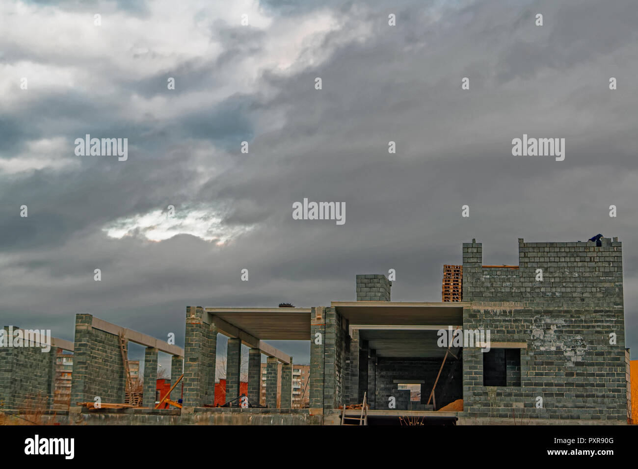 building under construction in evening sky Stock Photo - Alamy