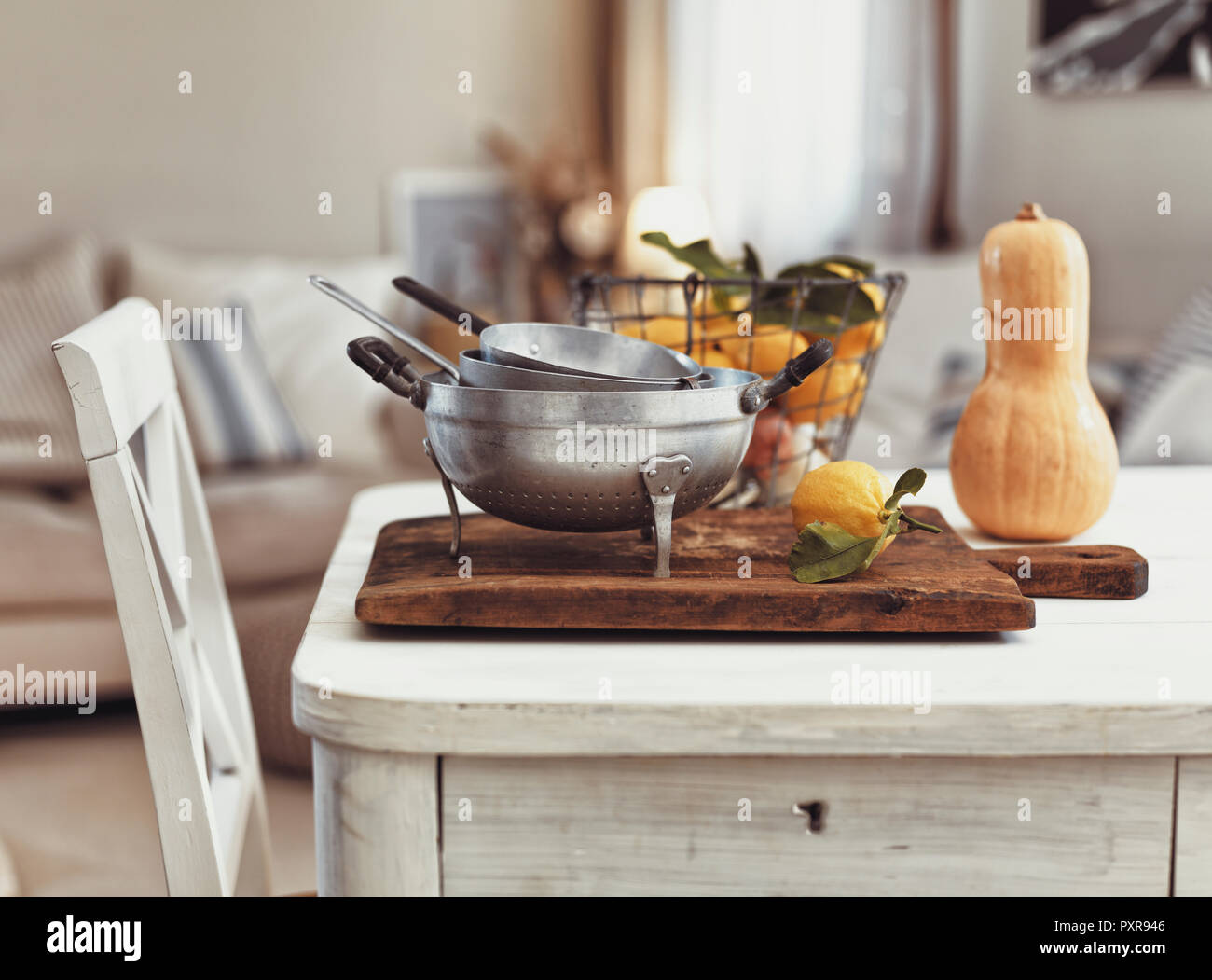 Nostalgic kitchen utensils and fruits on old wooden table Stock Photo ...