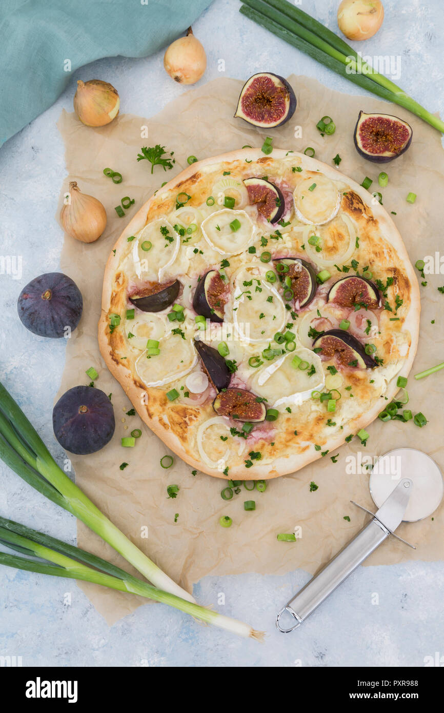 Homemade Tarte Flambee with figs, spring onions and goat cheese Stock ...