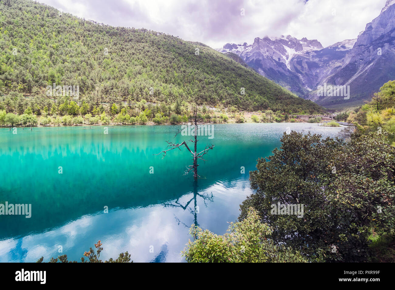 China, Yunnan, Lijiang, lake and Jade Dragon Snow Mountain in ...