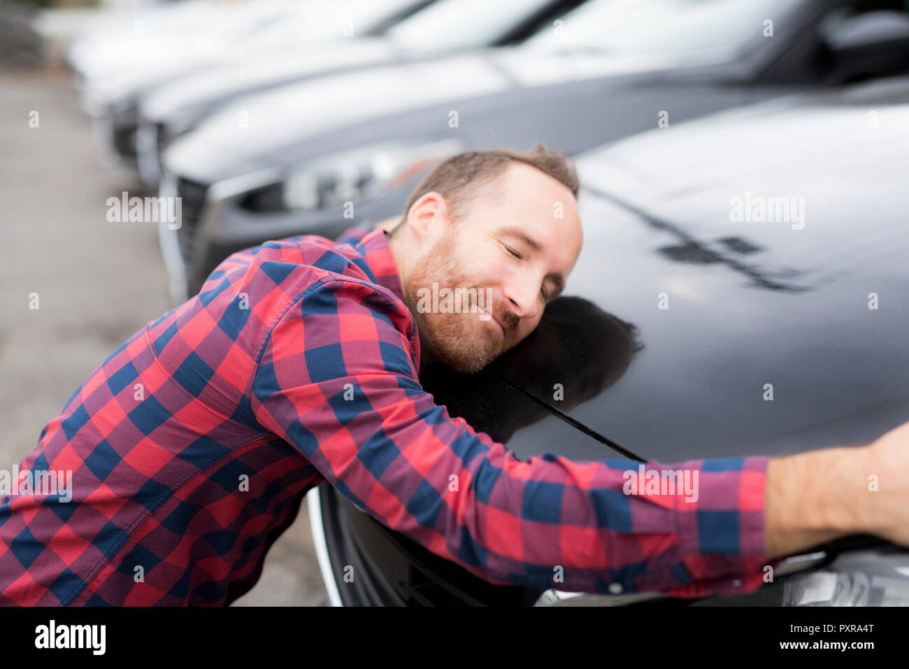 Man hugging his car hi-res stock photography and images - Alamy