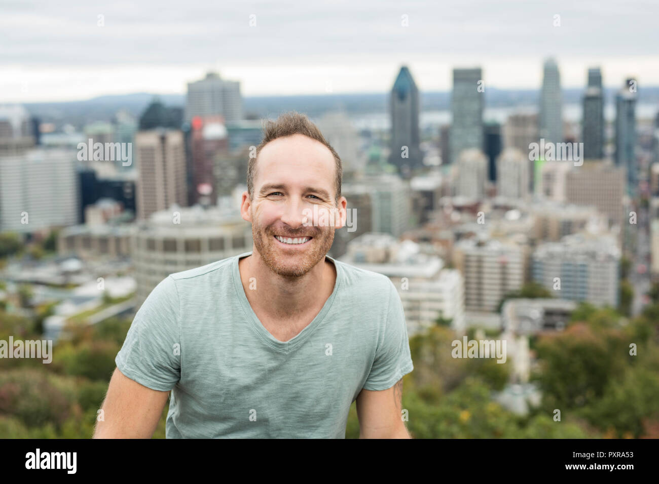 men portrait with montreal city in background Stock Photo - Alamy