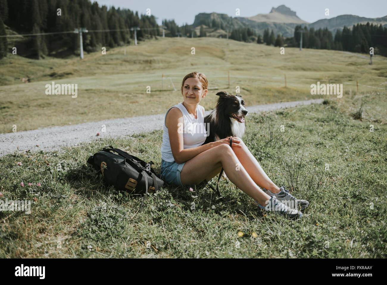 Woman with dog on a trip in the mountains hi-res stock photography and ...