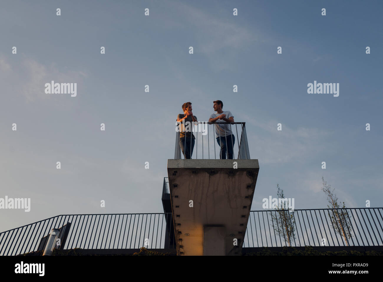 Two friends standing observation platform hi-res stock photography and ...