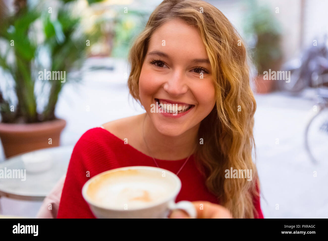 Beautiful young woman enjoying tea hi-res stock photography and images ...