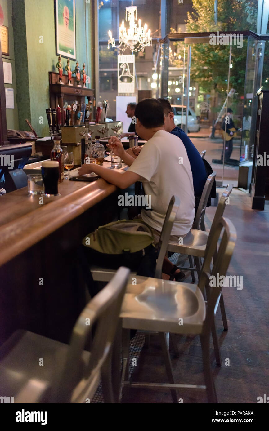 people enjoy drink midnight in pub Vancouver Canada Stock Photo - Alamy