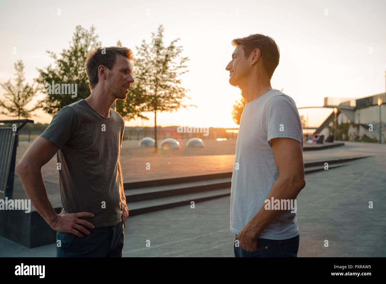 Male speaking to friends hi-res stock photography and images - Alamy