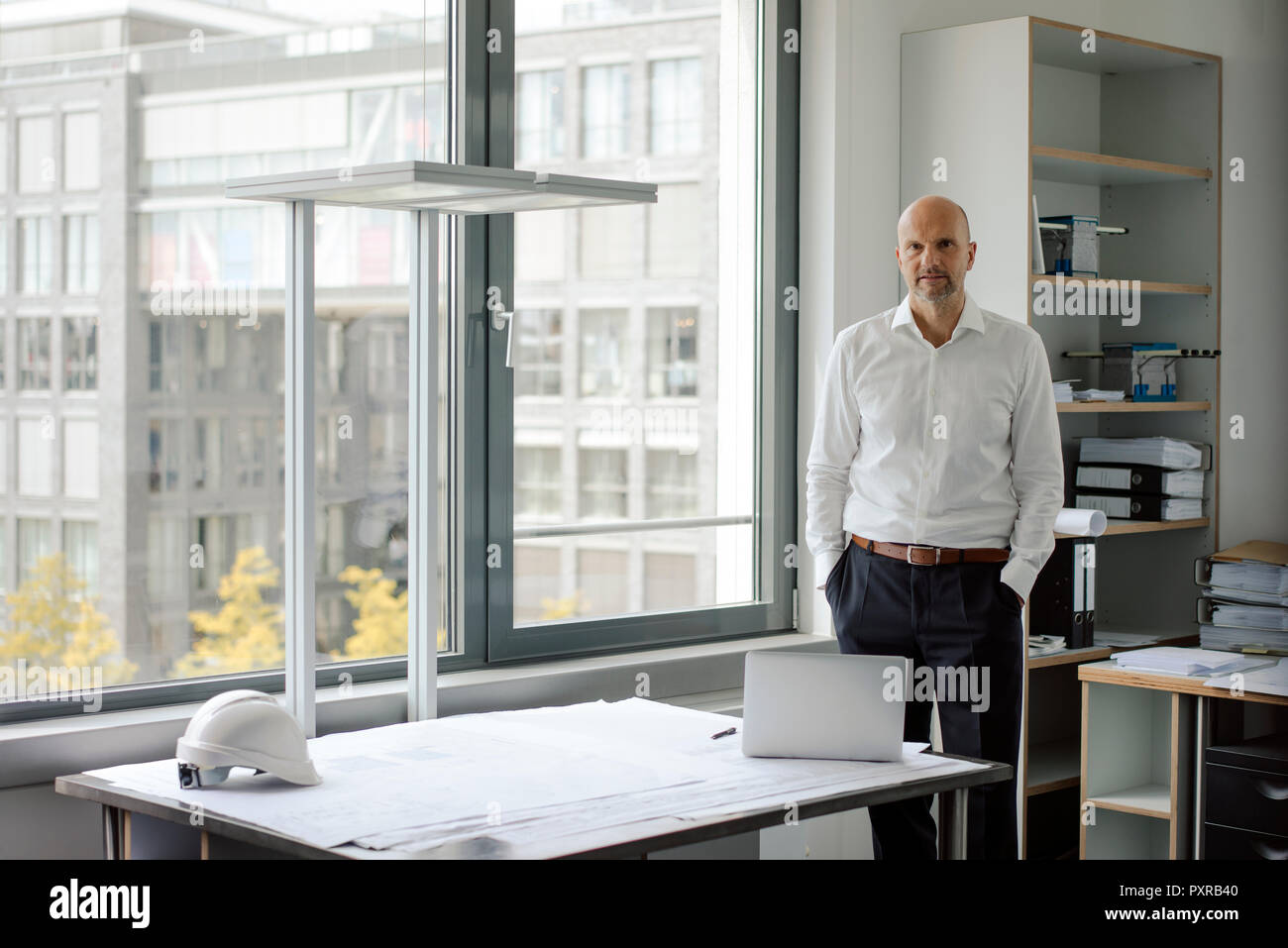 Men in helmets standing construction hi-res stock photography and ...