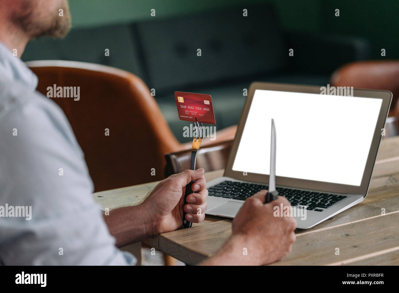 Man sitting in restaurant, waiting for delivery service Stock Photo - Alamy