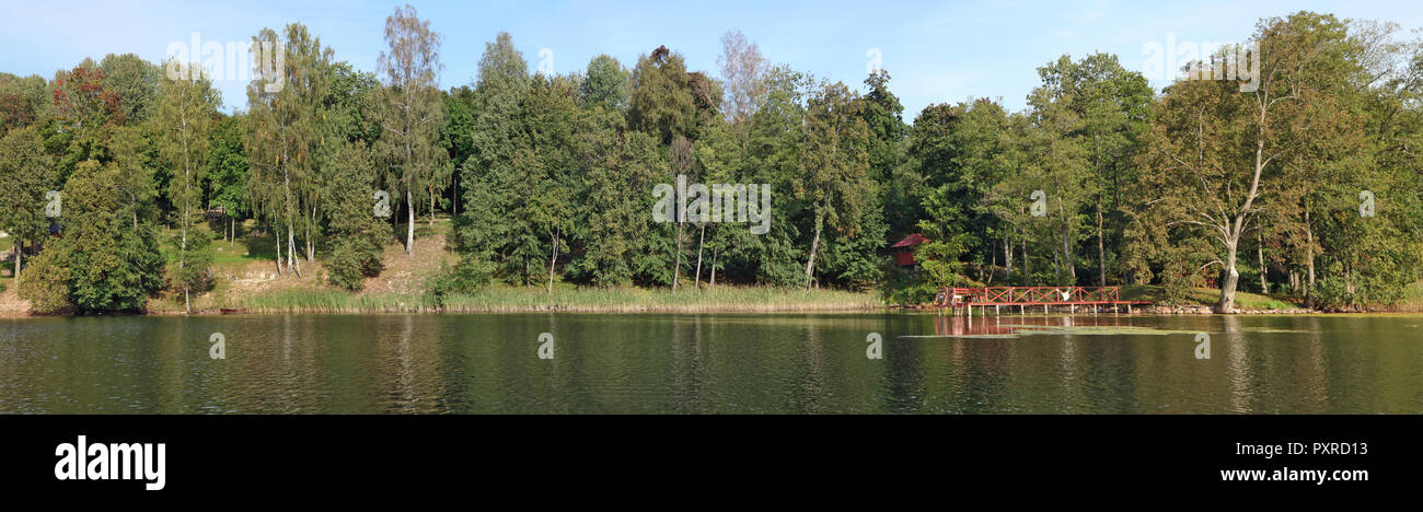 A typical rural Lithuanian landscape is a cold lake coast, birch forest ...