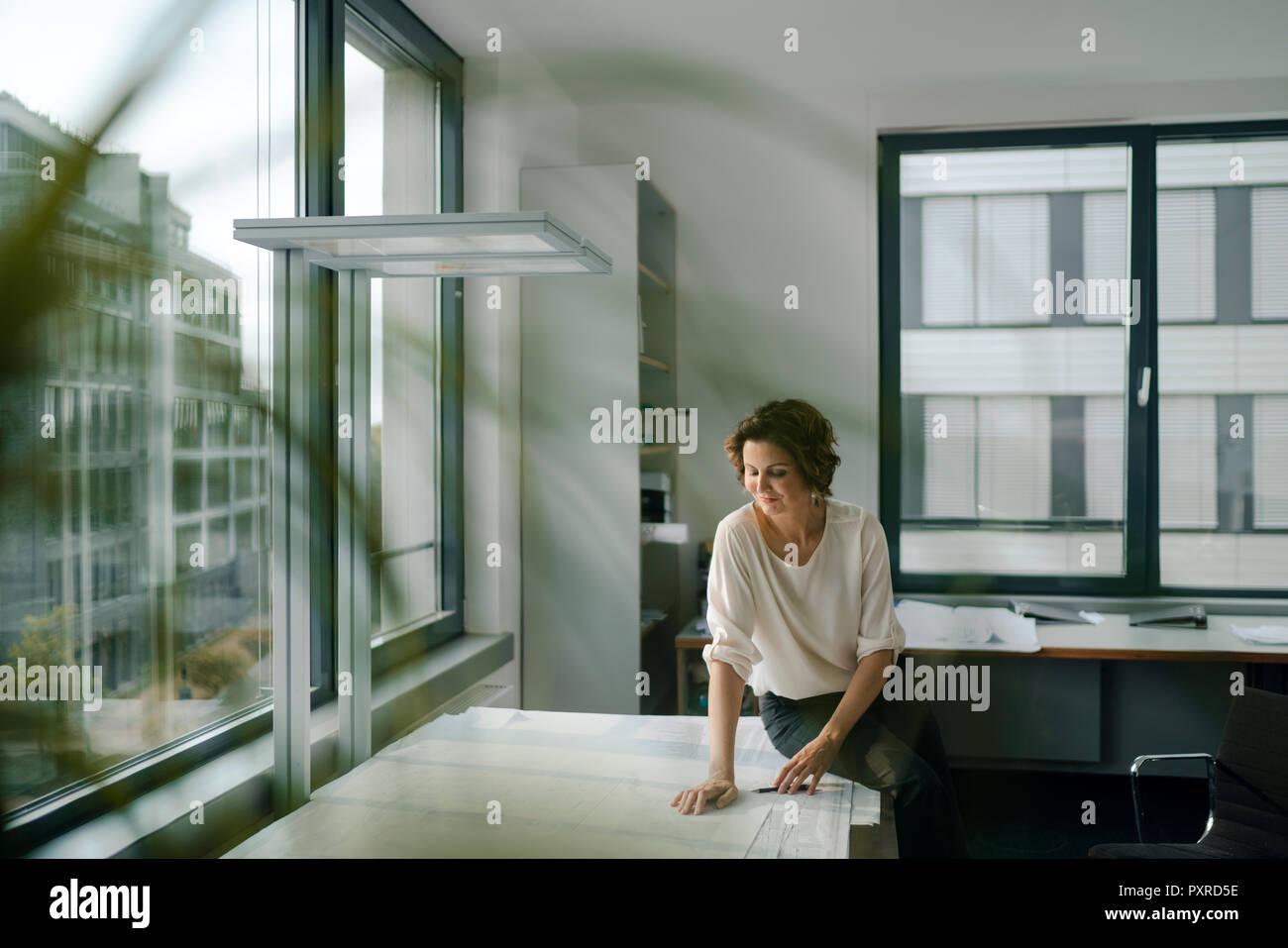 Engineer architect working on blueprints hi-res stock photography and ...