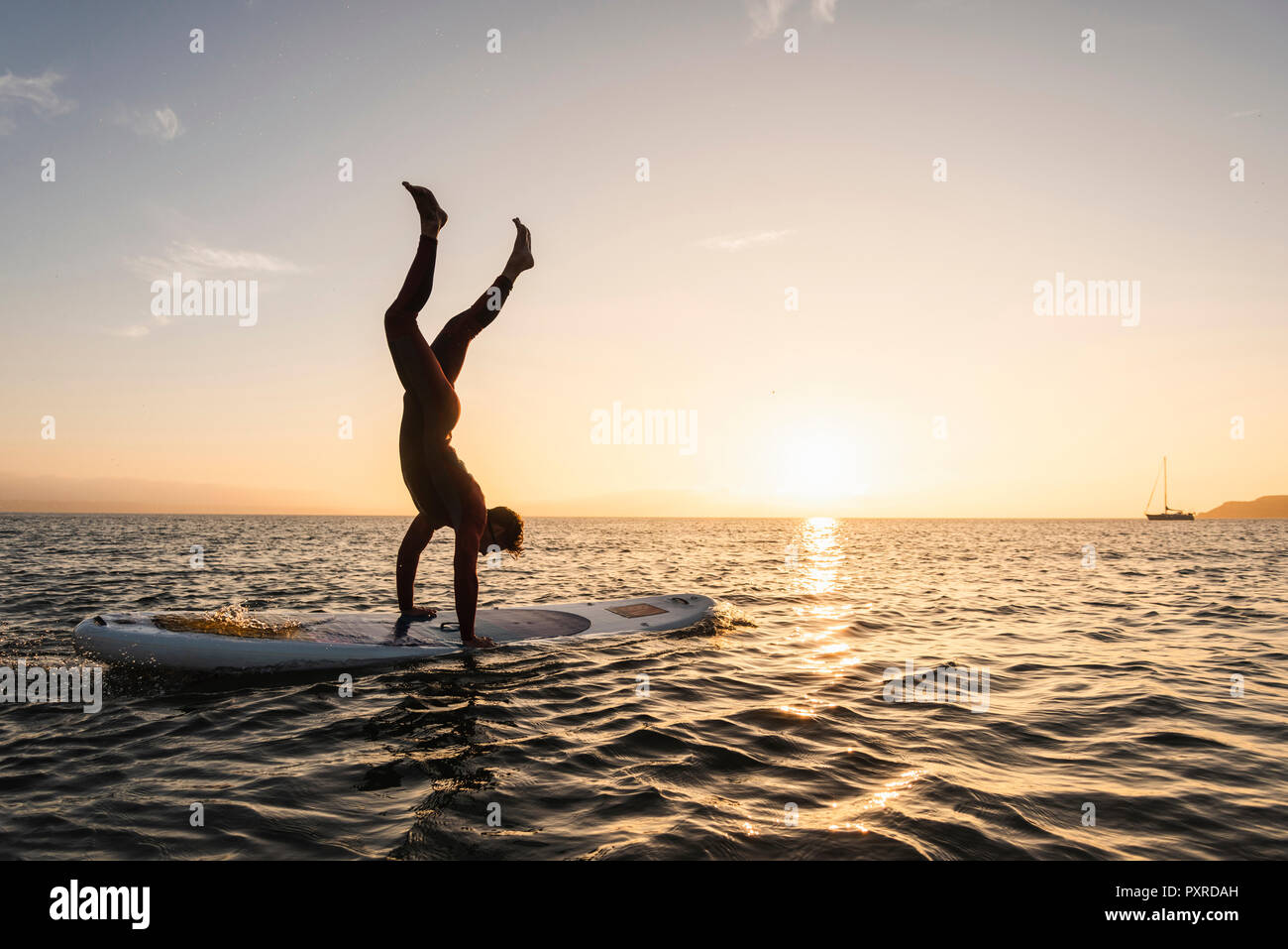 Person doing handstand on standup paddleboard hi-res stock photography ... Person doing handstand on standup paddleboard hi-res stock photography ...