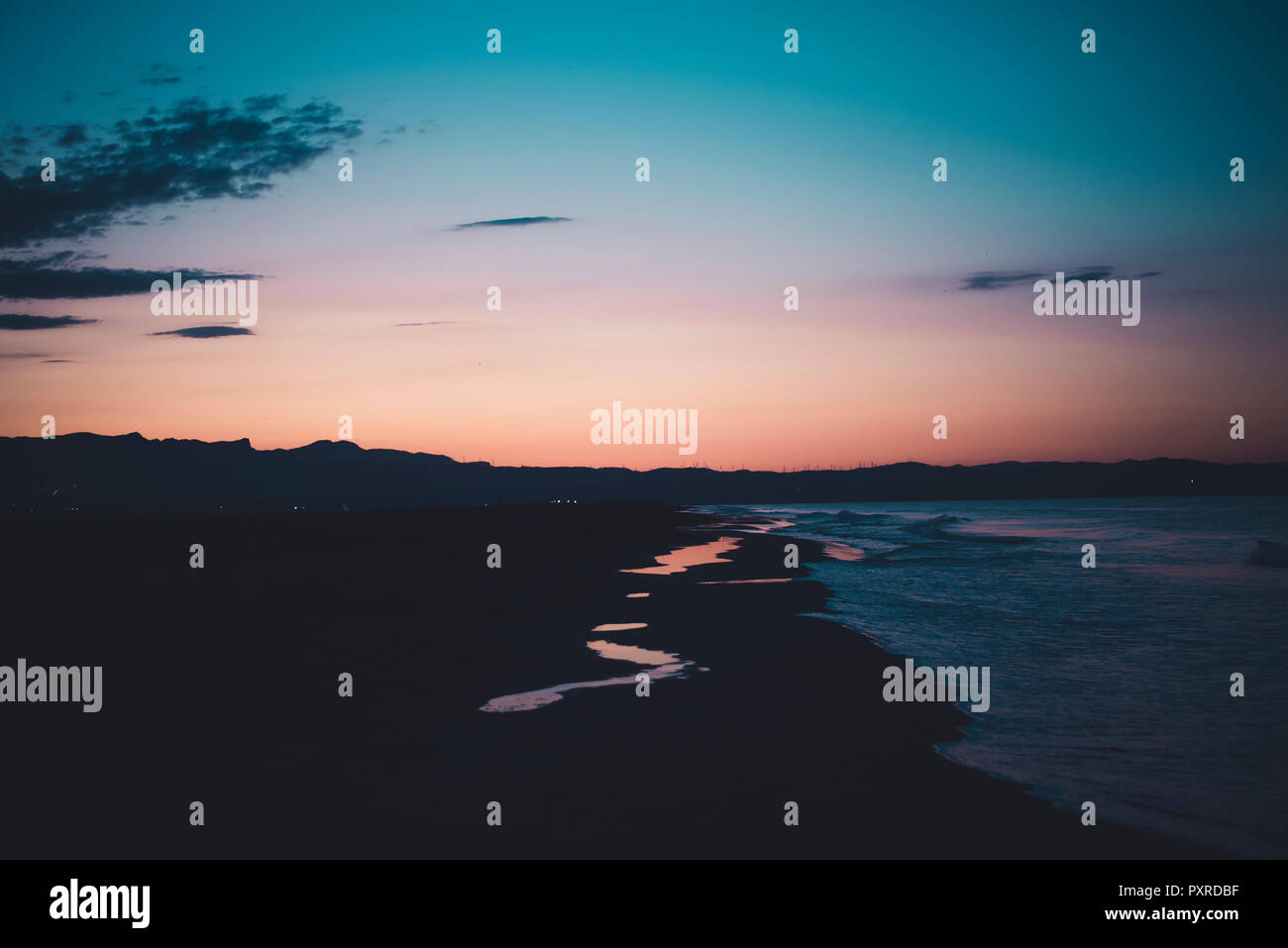 Spain, coast at sunset Stock Photo - Alamy