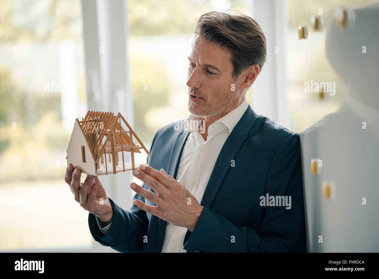 Mature businessman sharing his knowledge with younger colleague Stock ...