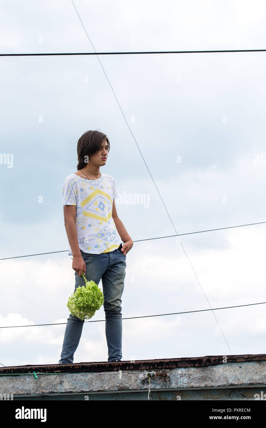 Sad guy on the roof Stock Photo - Alamy