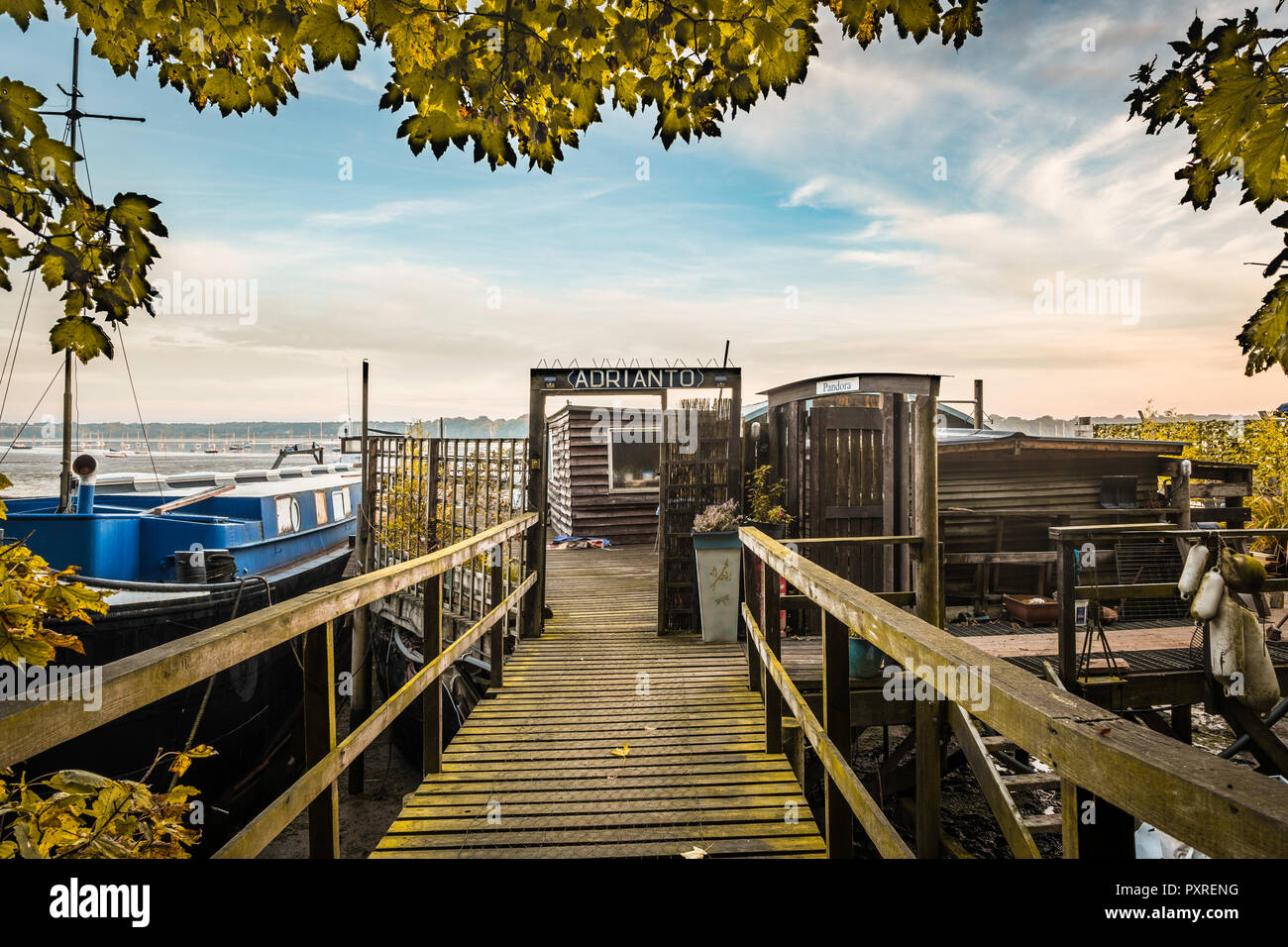 Jetty leading to two barge based houseboats at Pin Mill Stock Photo - Alamy