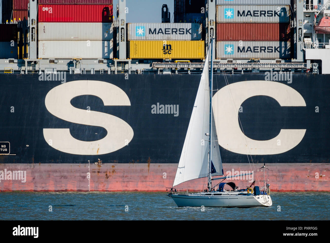 Dwarfed by container ship hi-res stock photography and images - Alamy
